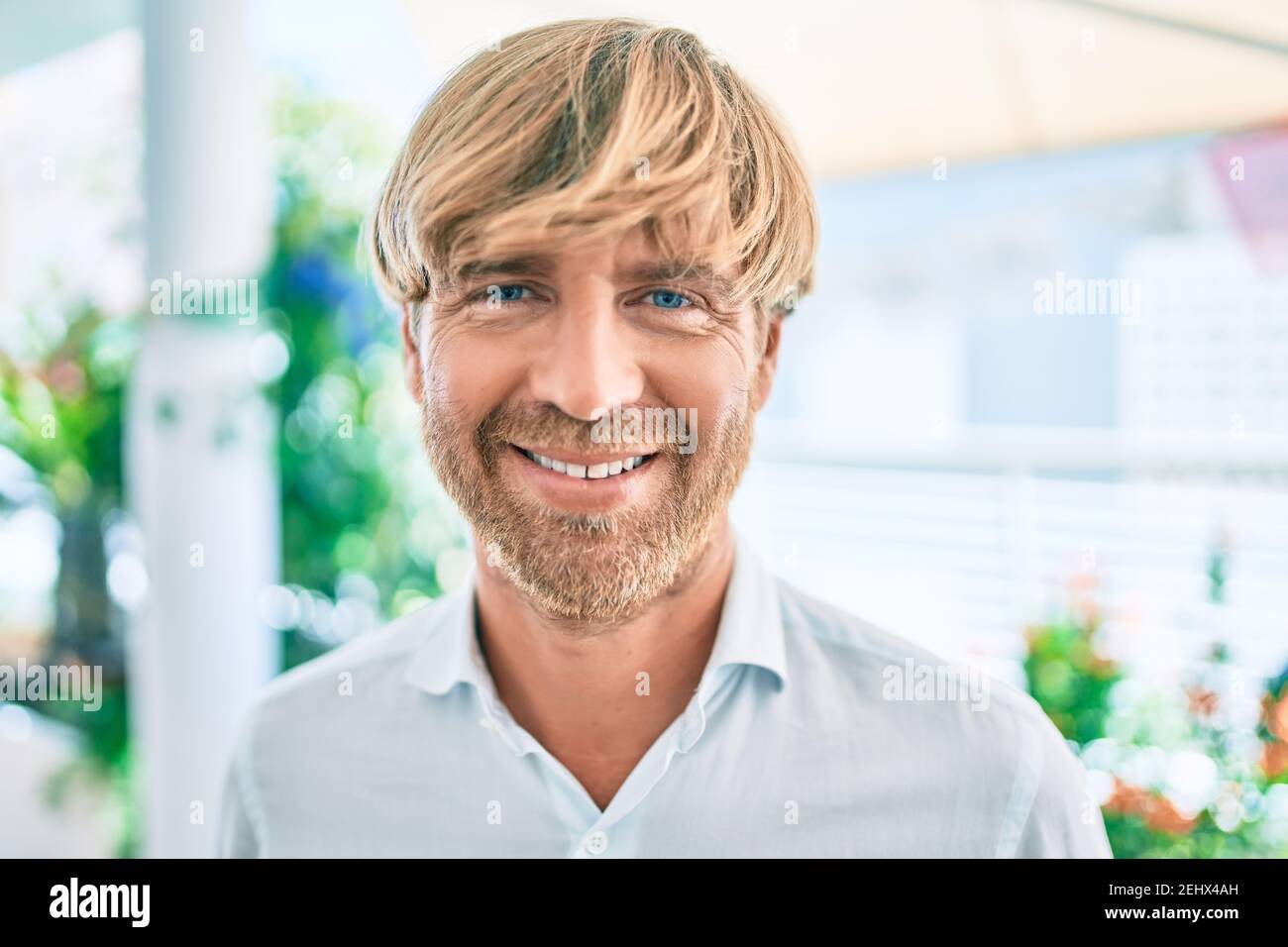 Young irish man smiling happy standing at terrace Stock Photo - Alamy