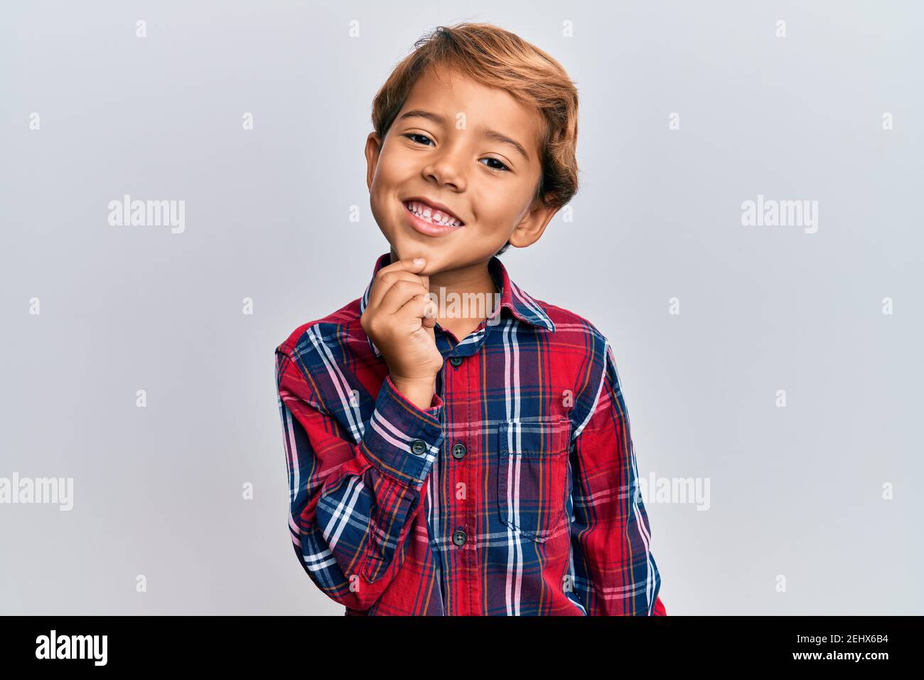 Adorable latin kid wearing casual clothes smiling looking confident at ...