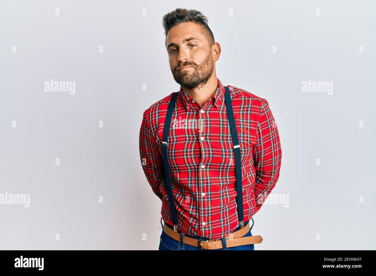 Handsome man with beard wearing hipster elegant look depressed and ...