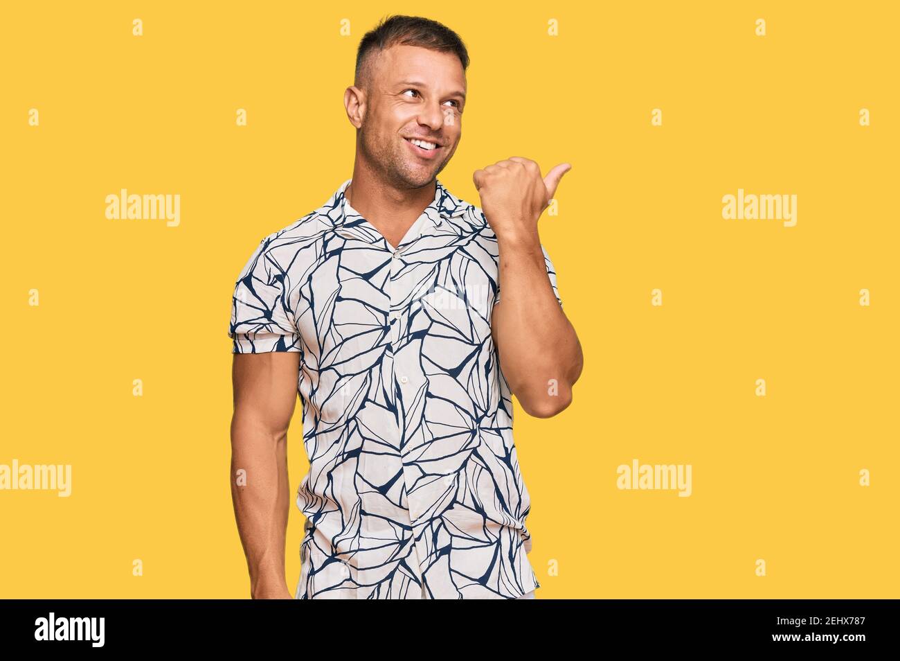 Handsome muscle man wearing casual clothes smiling with happy face ...