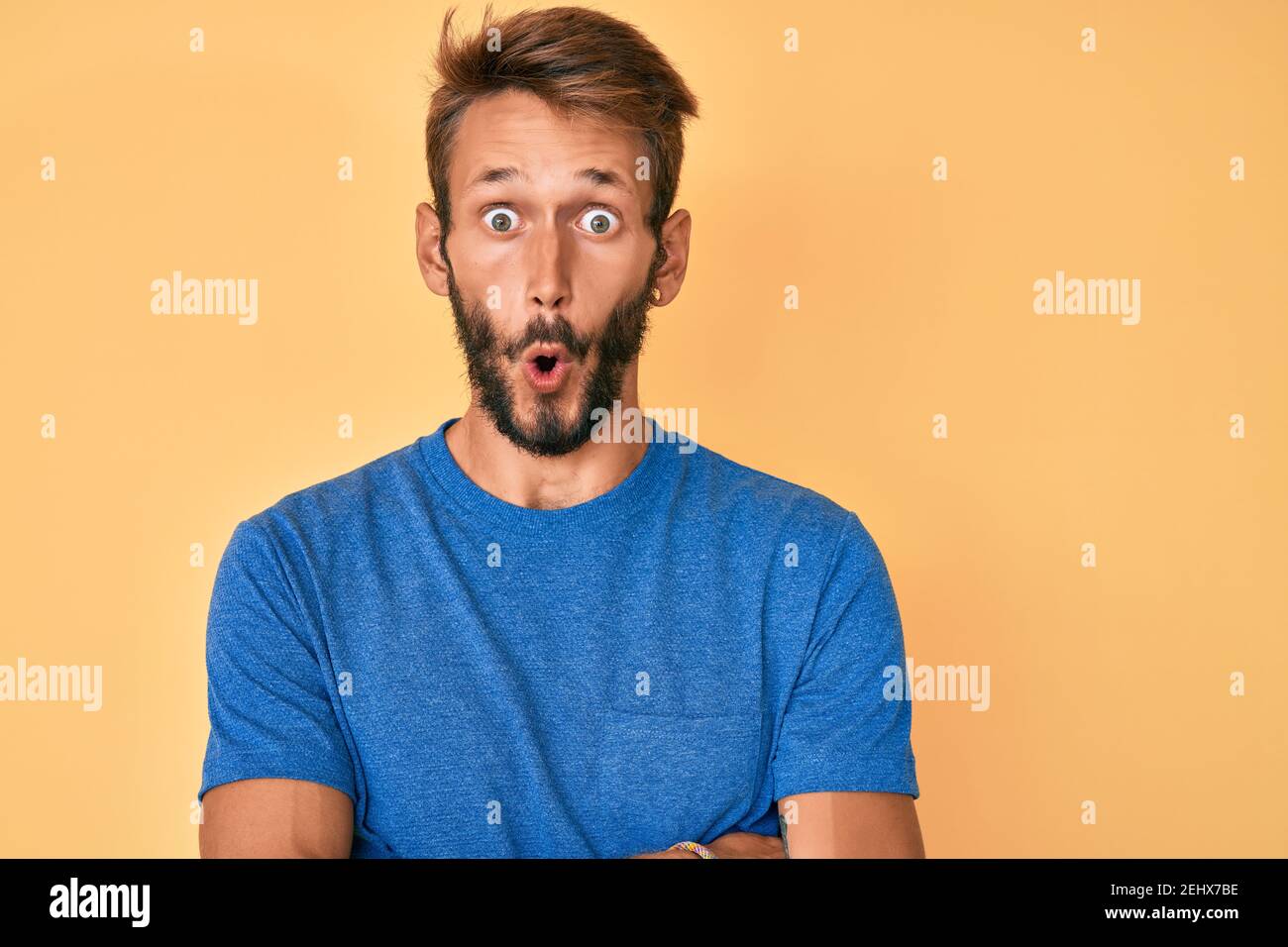 Handsome caucasian man with beard wearing casual clothes afraid and ...