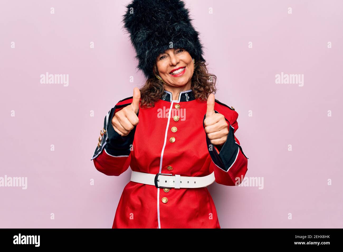 Middle age beautiful wales guard woman wearing traditional uniform over ...