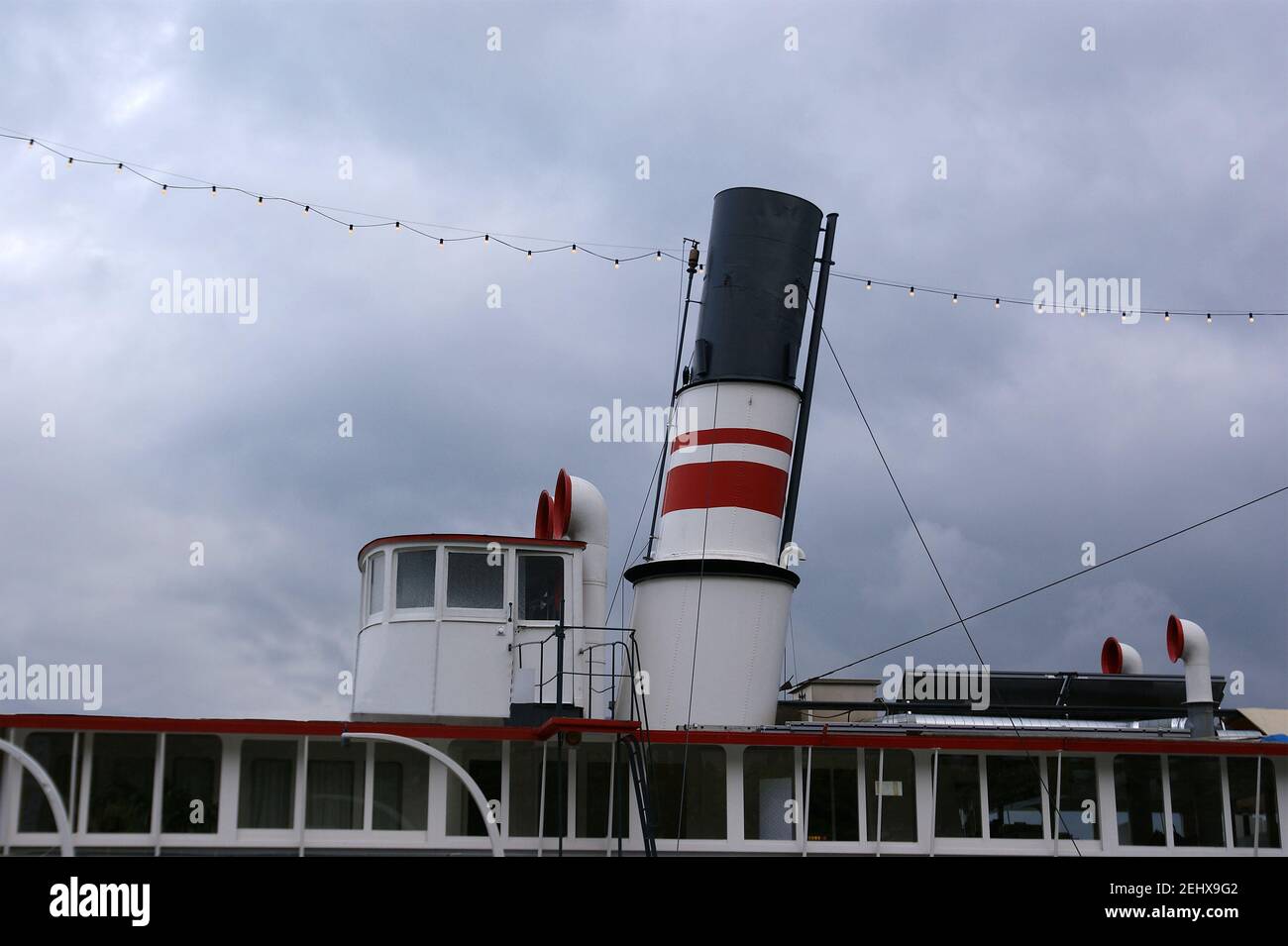 Ship funnels white and red on a large cruise riverboat Stock Photo - Alamy