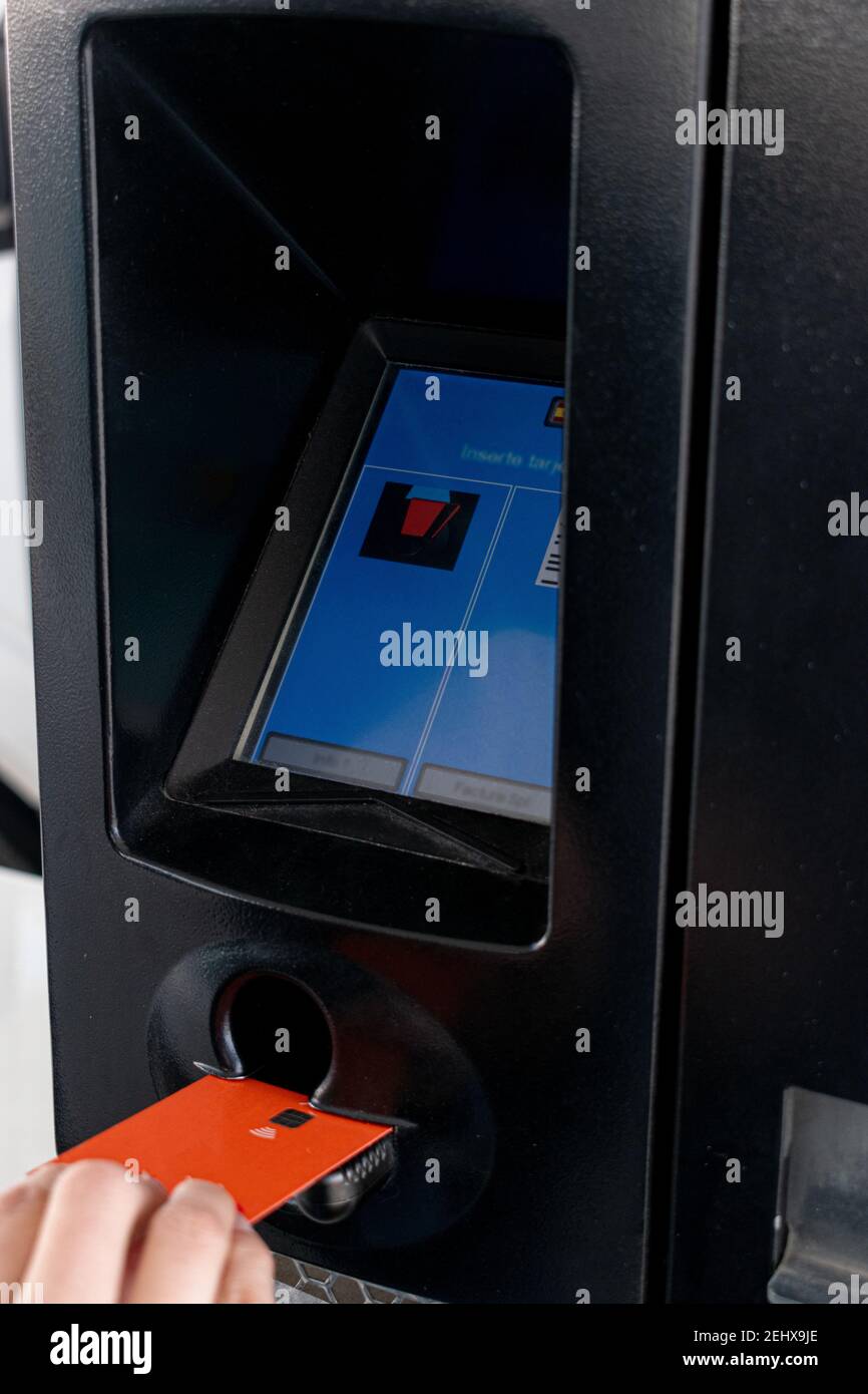 introducing the credit card to pay with an orange card Stock Photo - Alamy