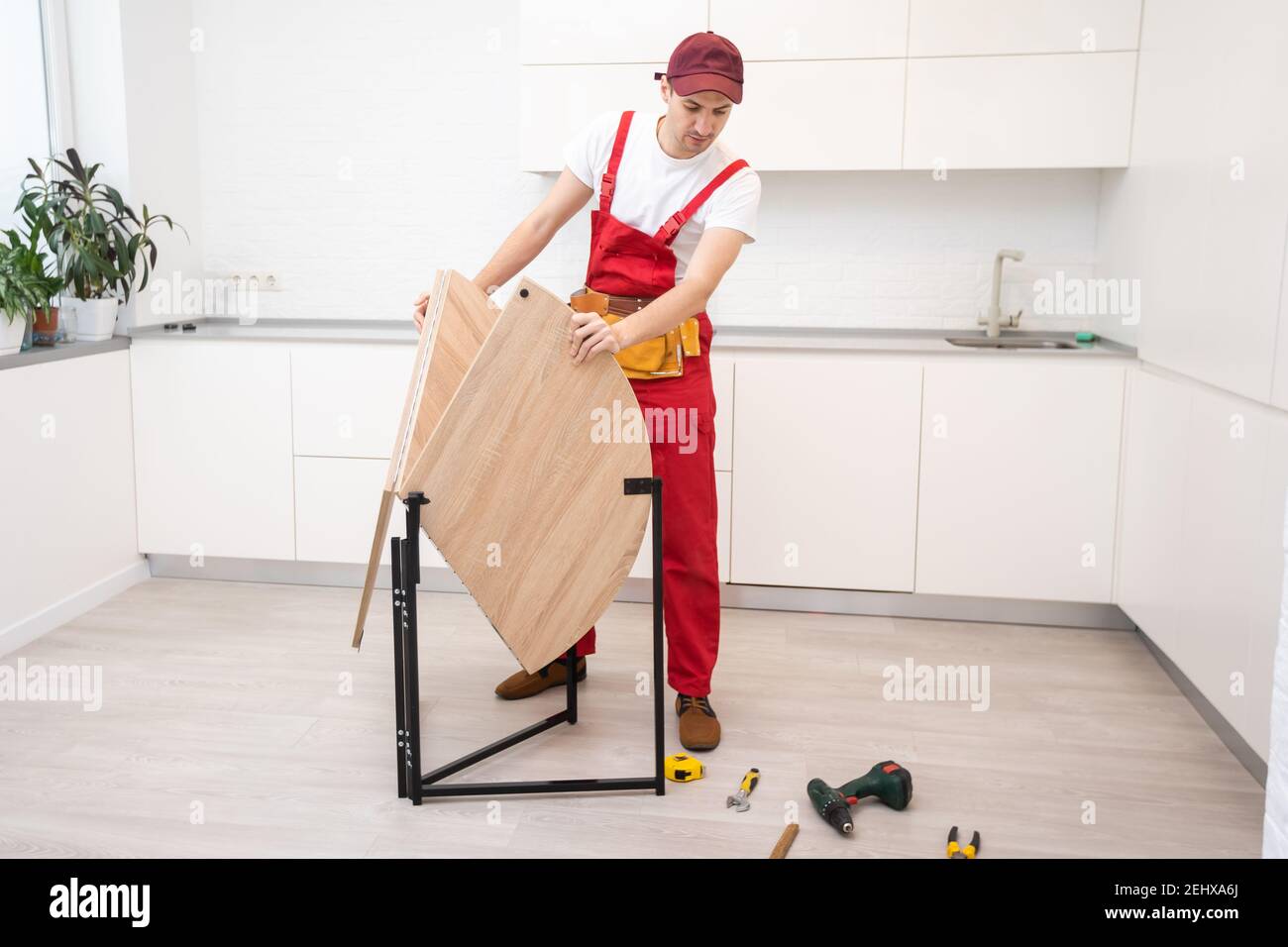 Young man assembling kitchen hi-res stock photography and images - Alamy