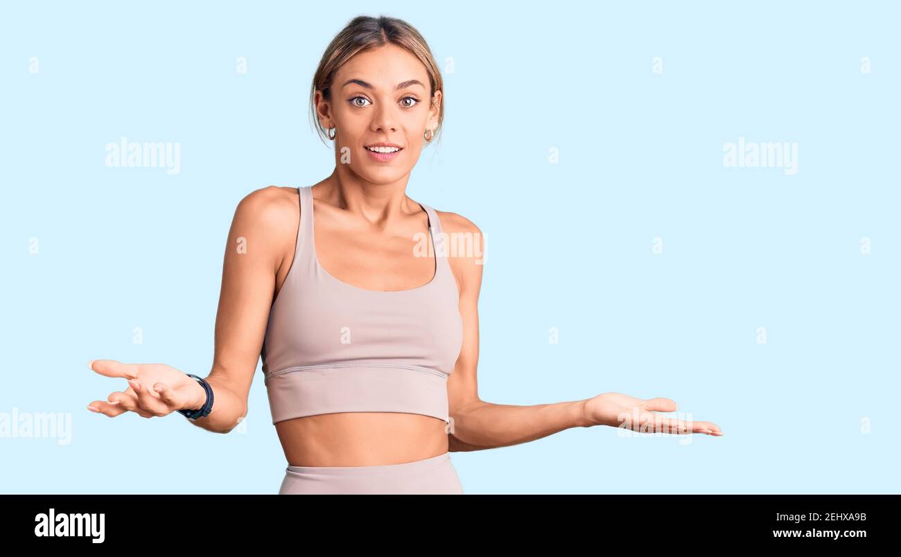 Beautiful caucasian woman wearing sportswear smiling cheerful with open ...