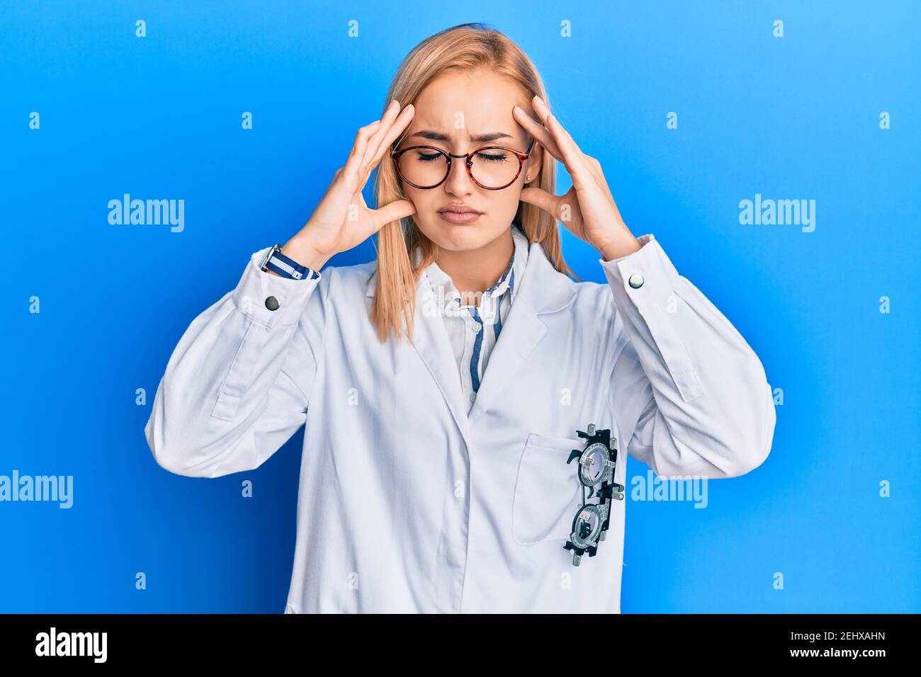 Beautiful caucasian oculist woman wearing robe and optometry glasses ...