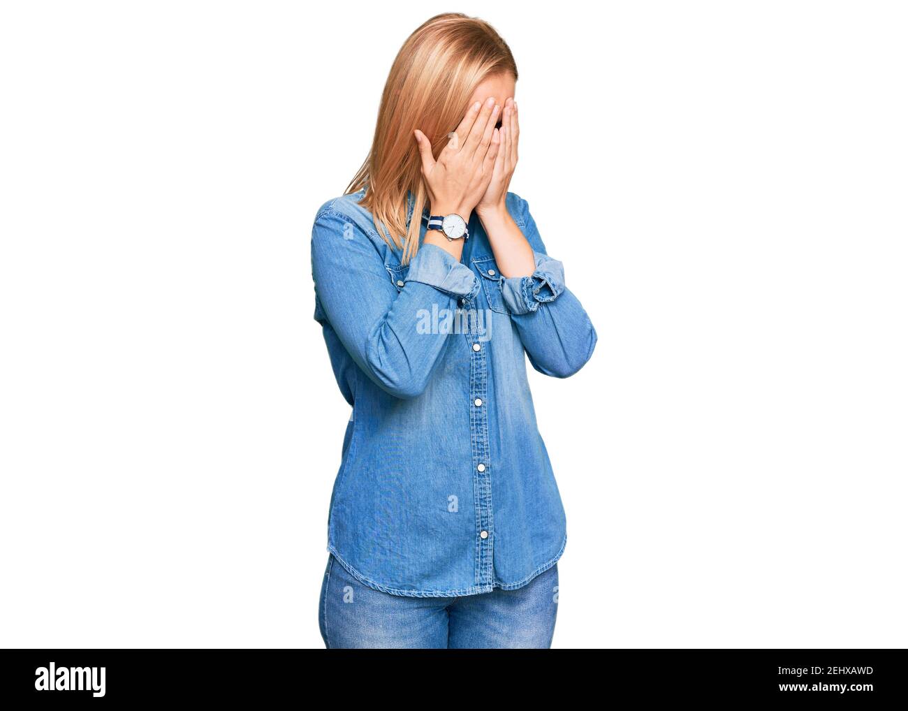 Beautiful caucasian woman wearing casual denim jacket with sad ...