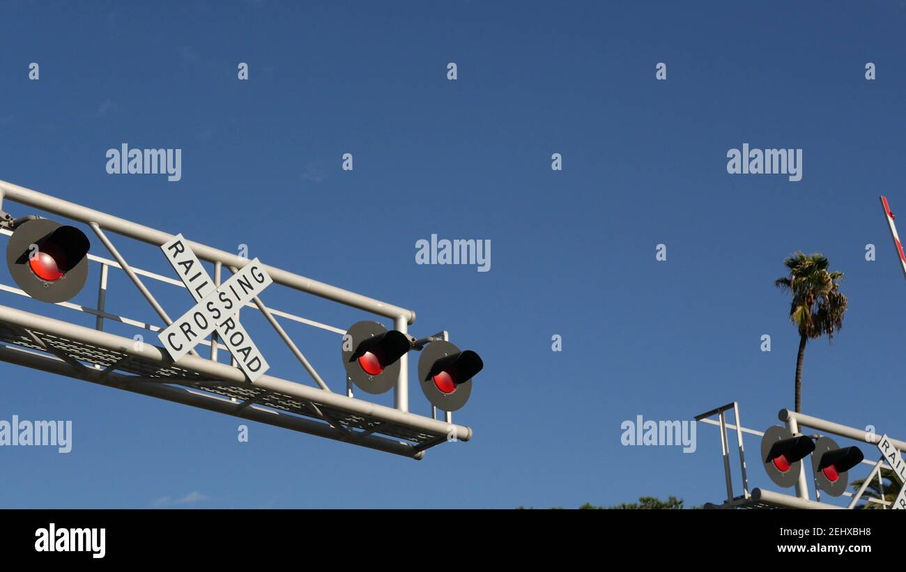 Level crossing warning signal in USA. Crossbuck notice and red traffic ...