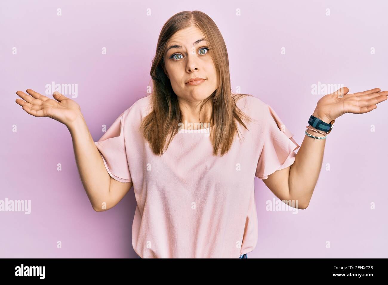Beautiful caucasian woman wearing casual clothes clueless and confused ...