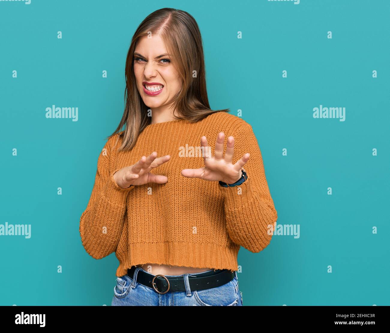 Beautiful caucasian woman wearing casual clothes disgusted expression ...