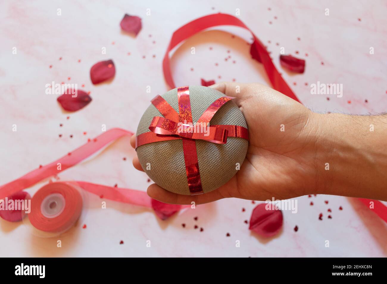 smart speaker wrapped with red gift bow Stock Photo - Alamy