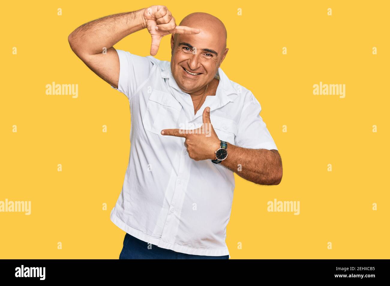 Mature middle east man with mustache wearing casual white shirt smiling ...