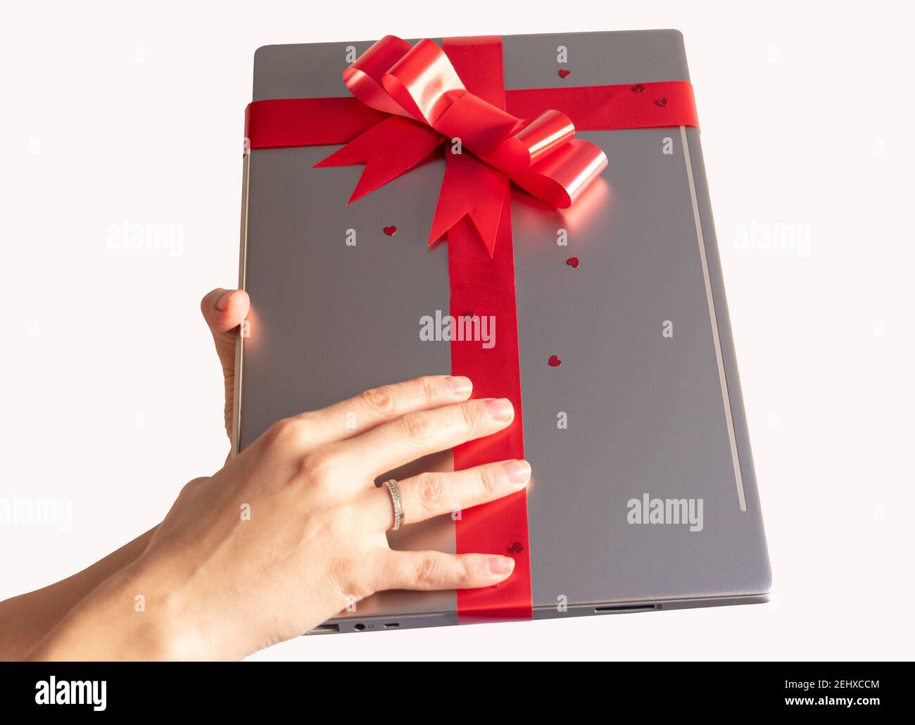 laptop wrapped with red gift bow with background ornaments Stock Photo ...