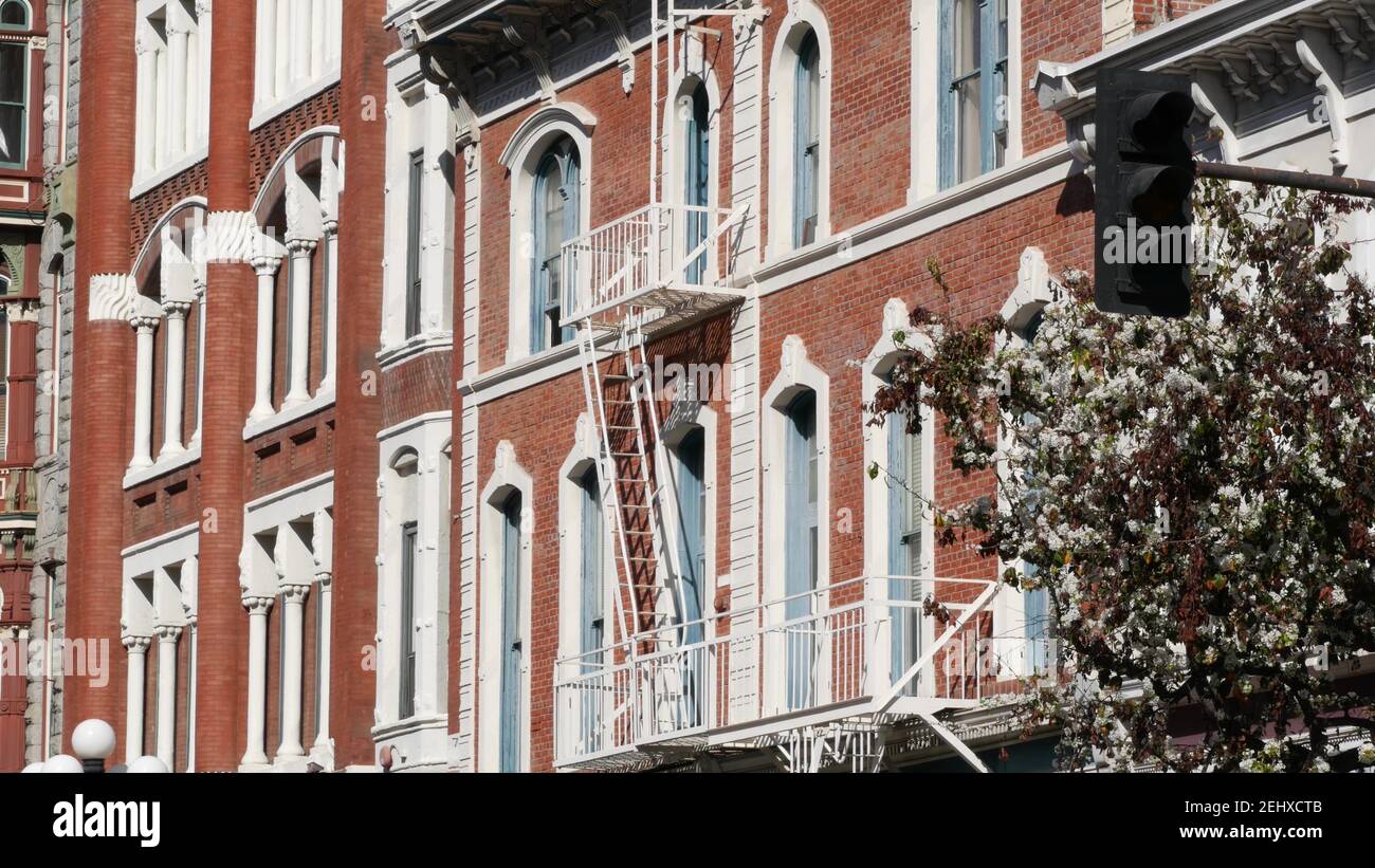 Fire escape ladder outside residential brick building in San Diego city ...