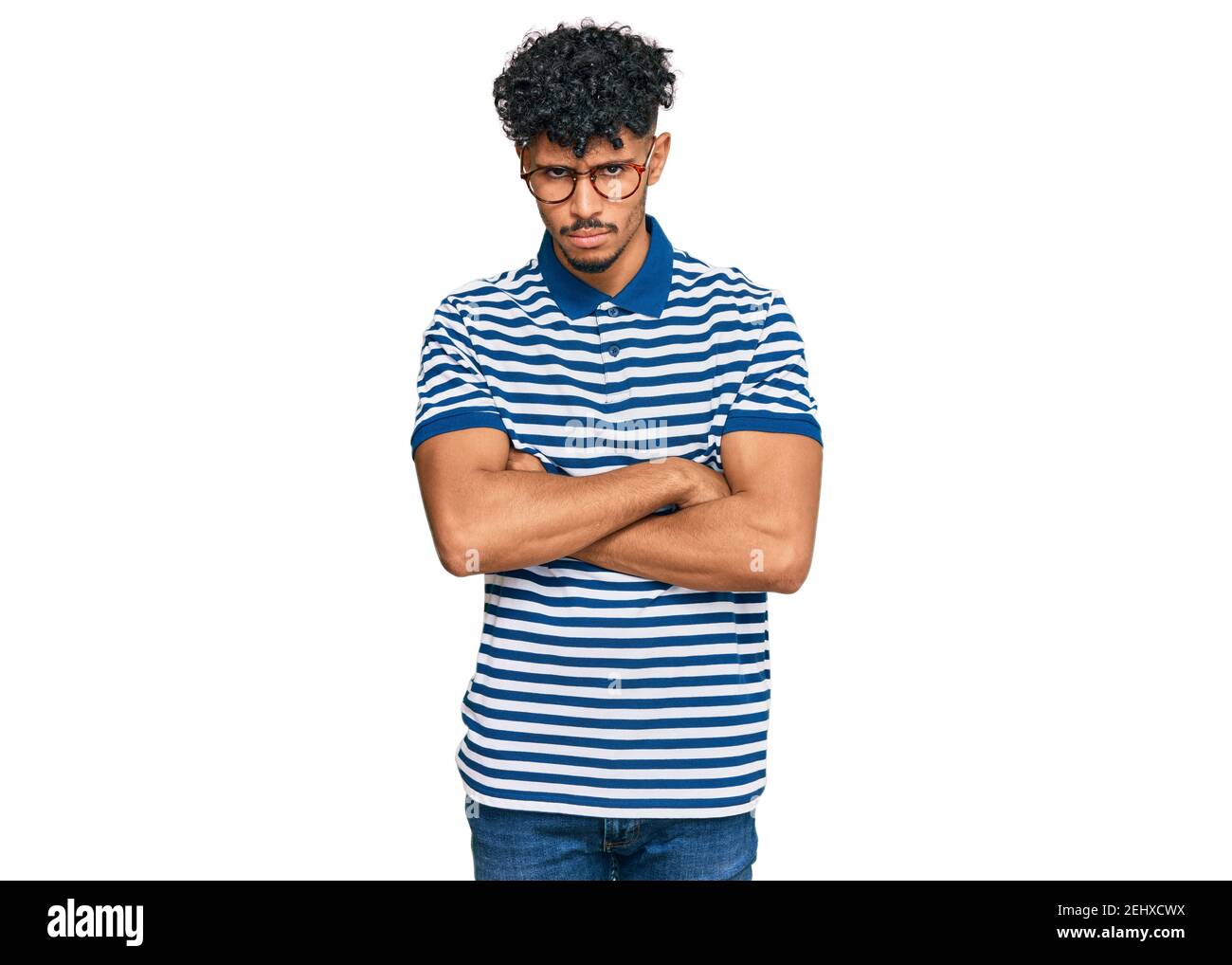 Young arab man wearing casual clothes and glasses skeptic and nervous ...