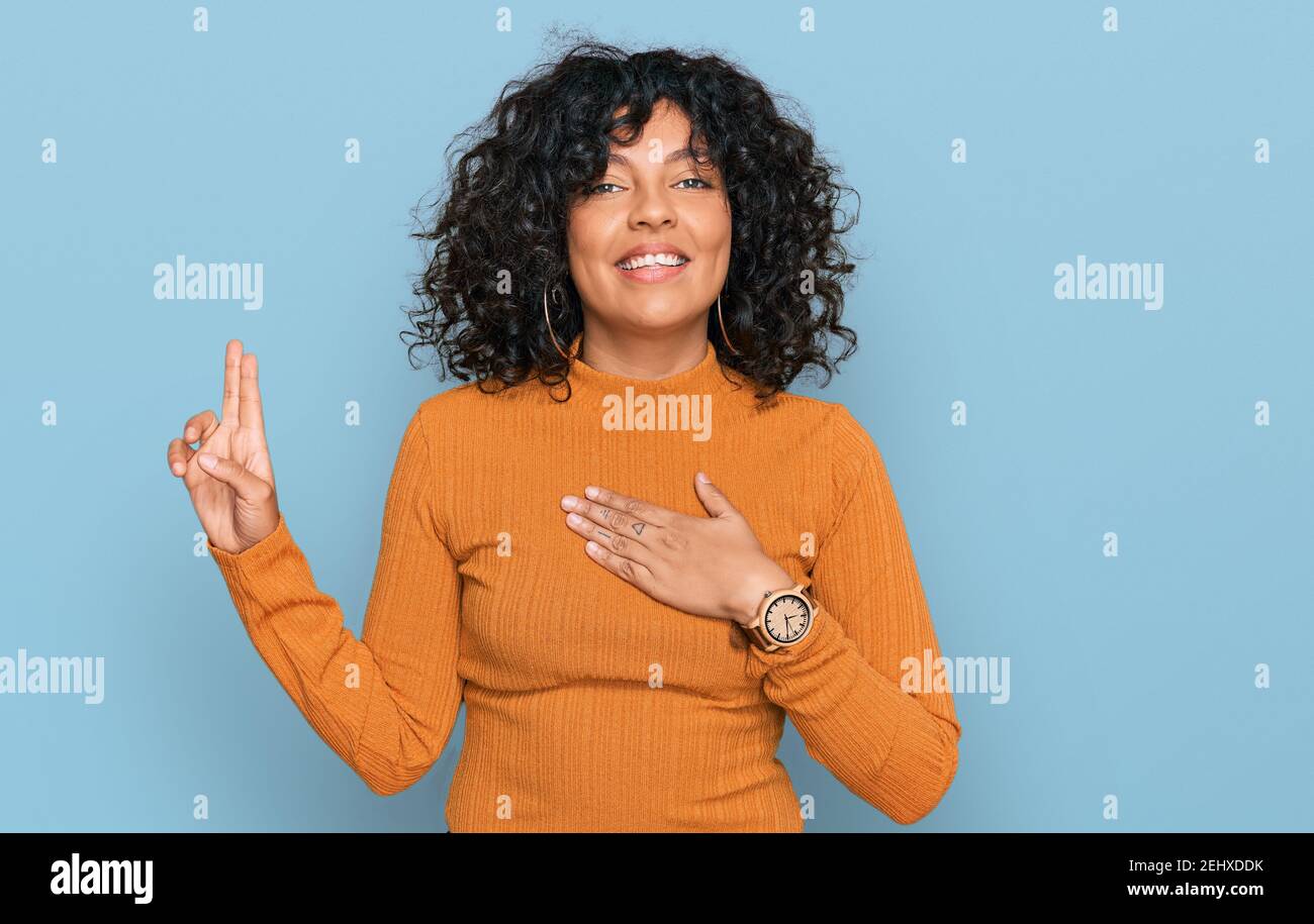 Young Hispanic Woman Wearing Casual Clothes Smiling Swearing With Hand