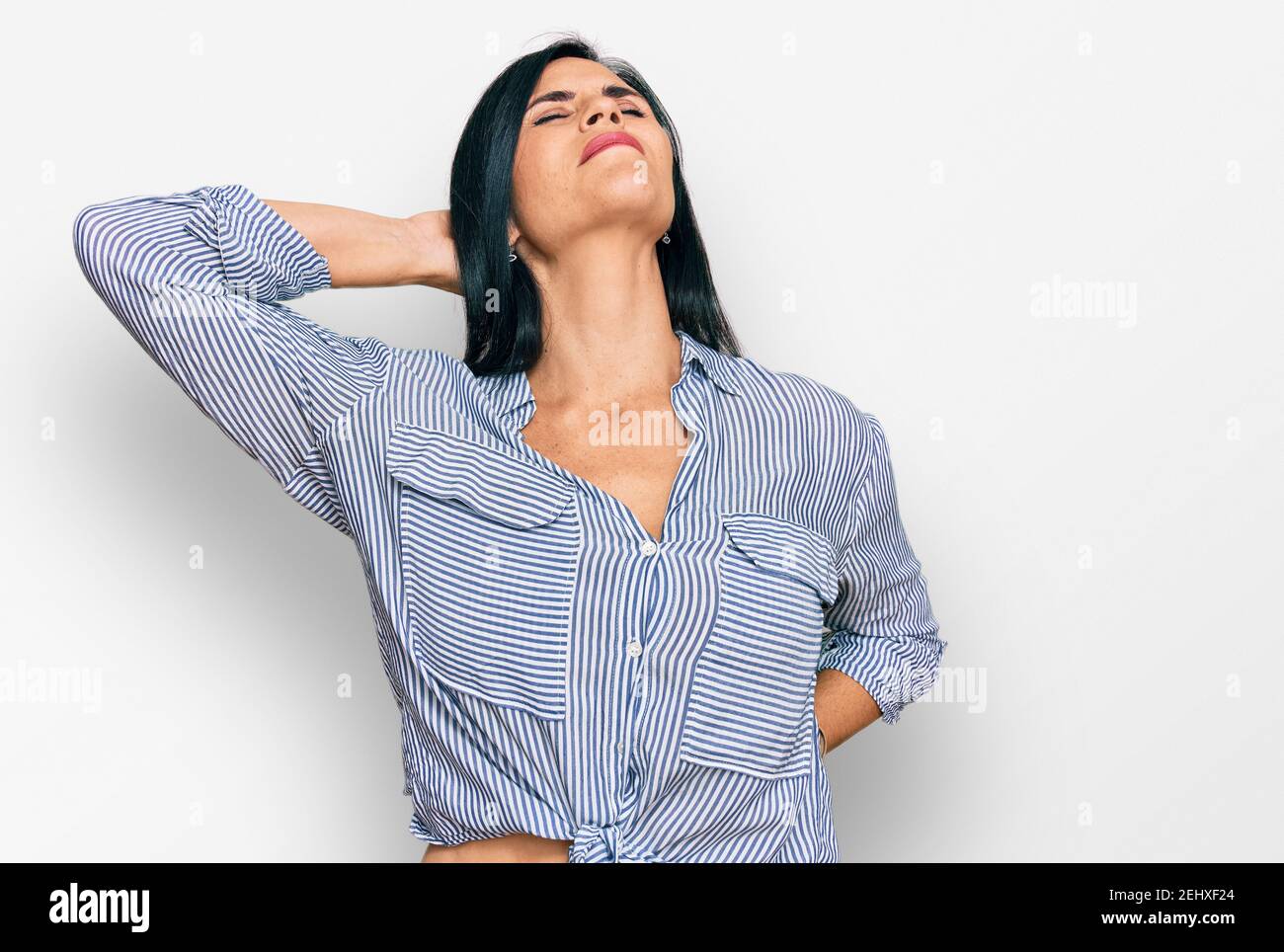 Young caucasian woman wearing casual clothes suffering of neck ache ...