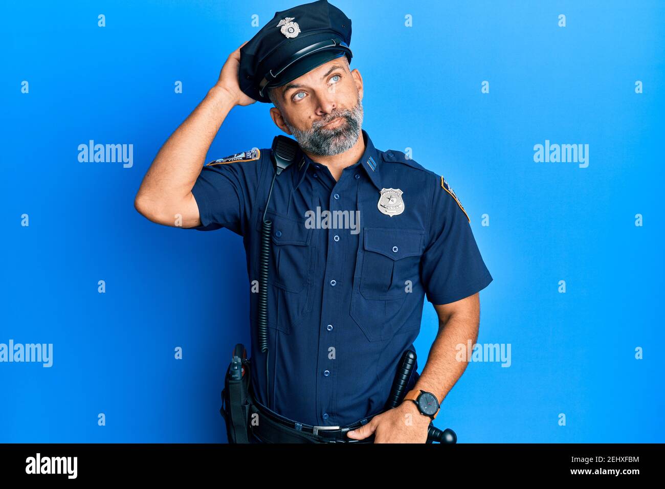Middle age handsome man wearing police uniform confuse and wondering ...