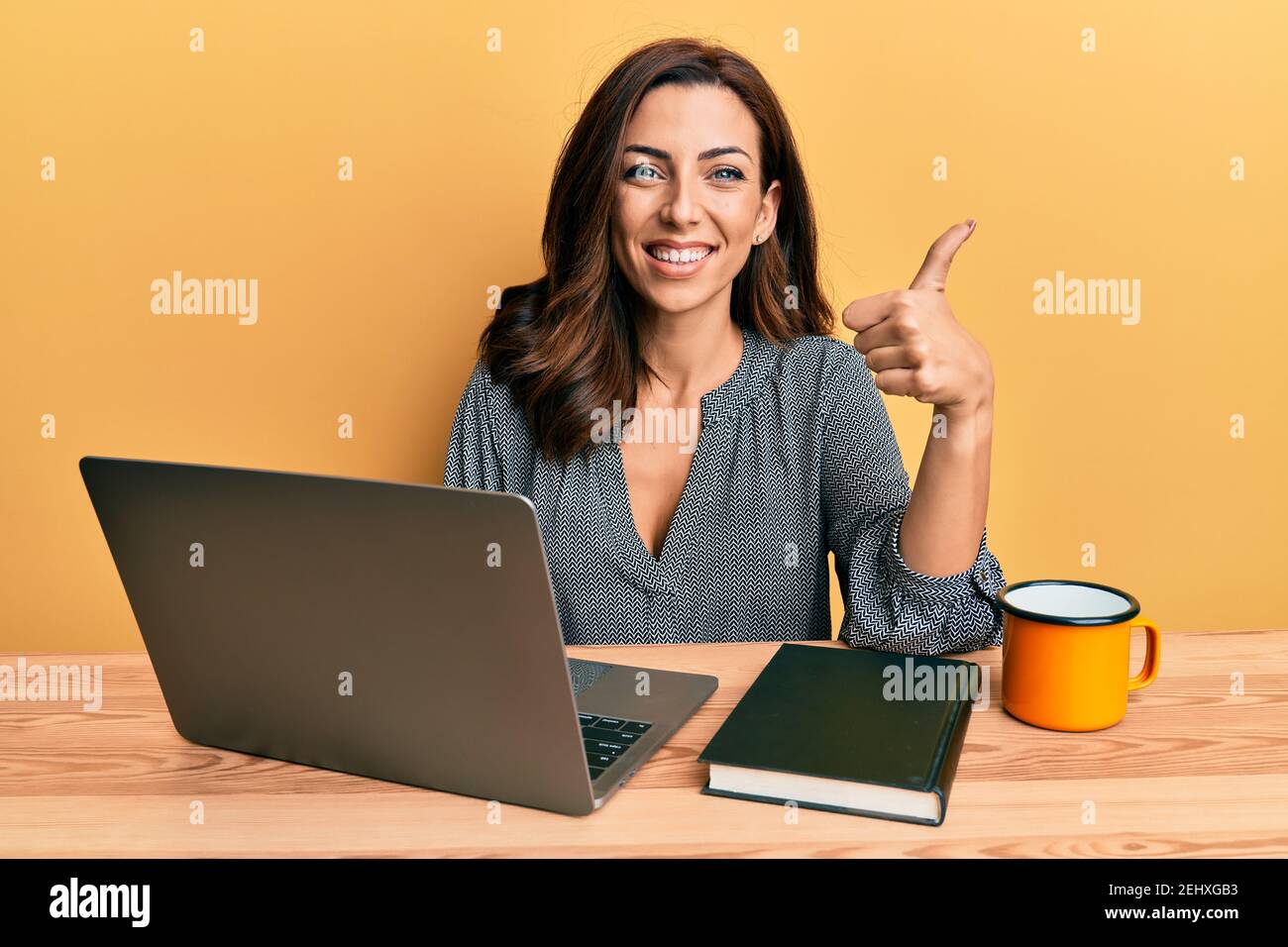 Young brunette woman working using computer laptop smiling happy and ...