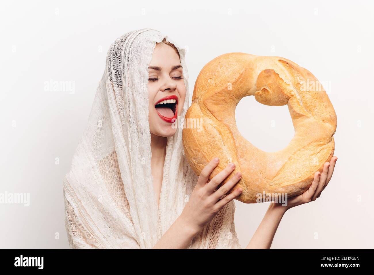 woman with round loaf of bread loaf model with transparent cloth on her ...