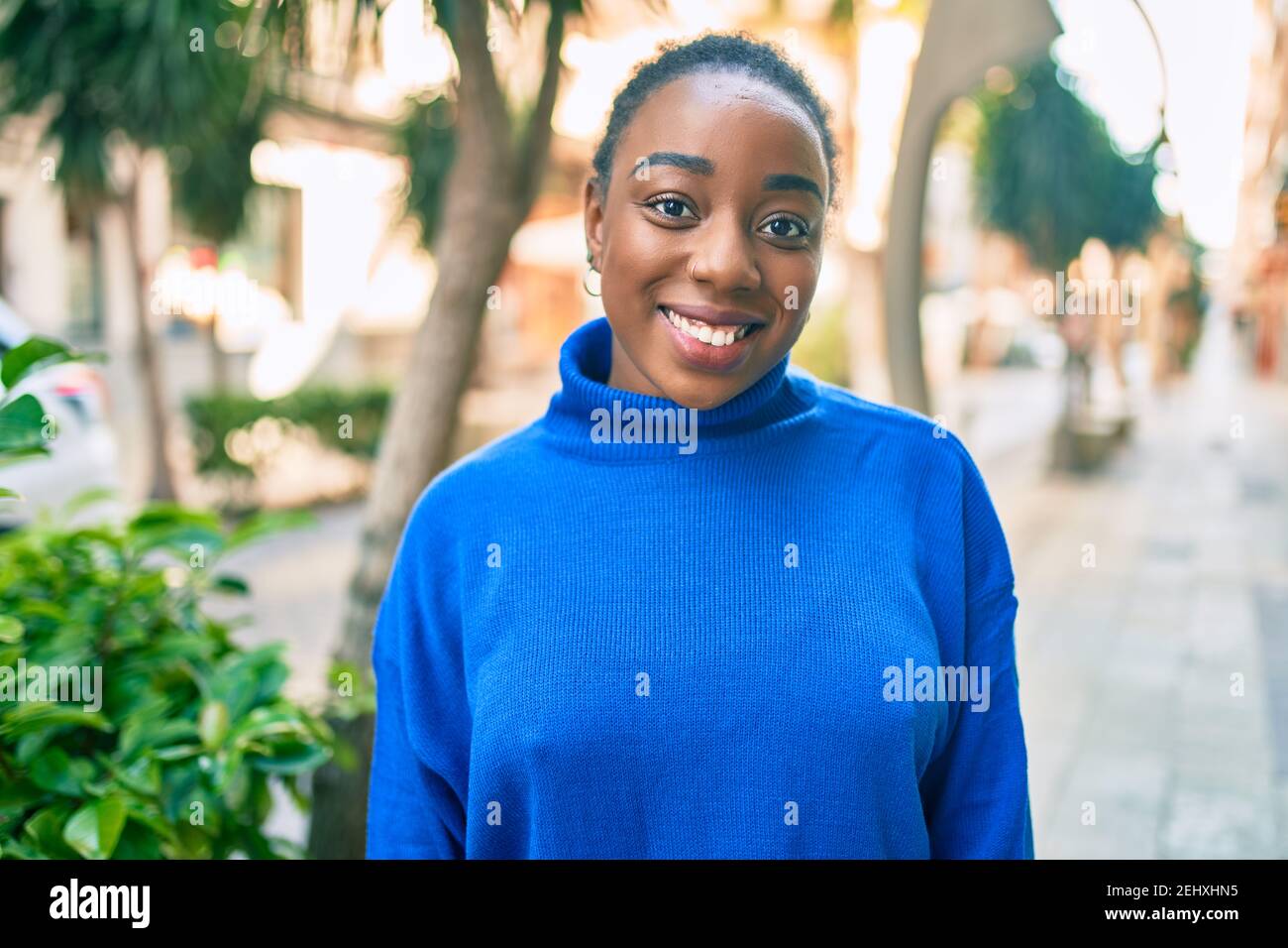 Young african american woman smiling happy walking at the park Stock ...