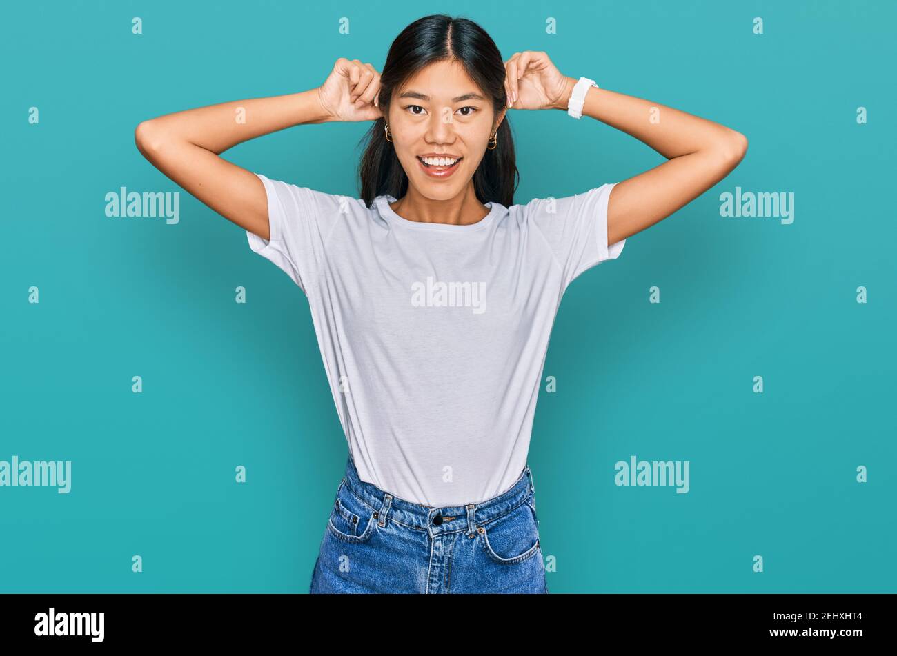Beautiful Young Asian Woman Wearing Casual White T Shirt Smiling