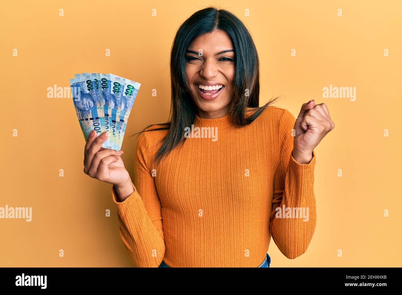 Young latin transsexual transgender woman holding south african 100 ...