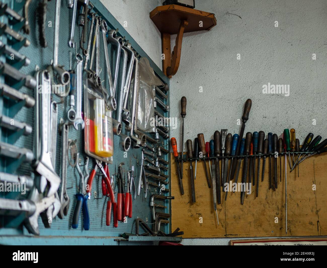 Tools hanging on the wall in the workshop Stock Photo - Alamy