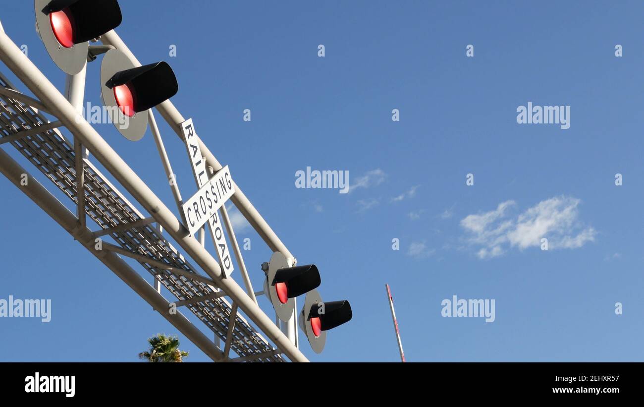 Level crossing warning signal in USA. Crossbuck notice and red traffic ...