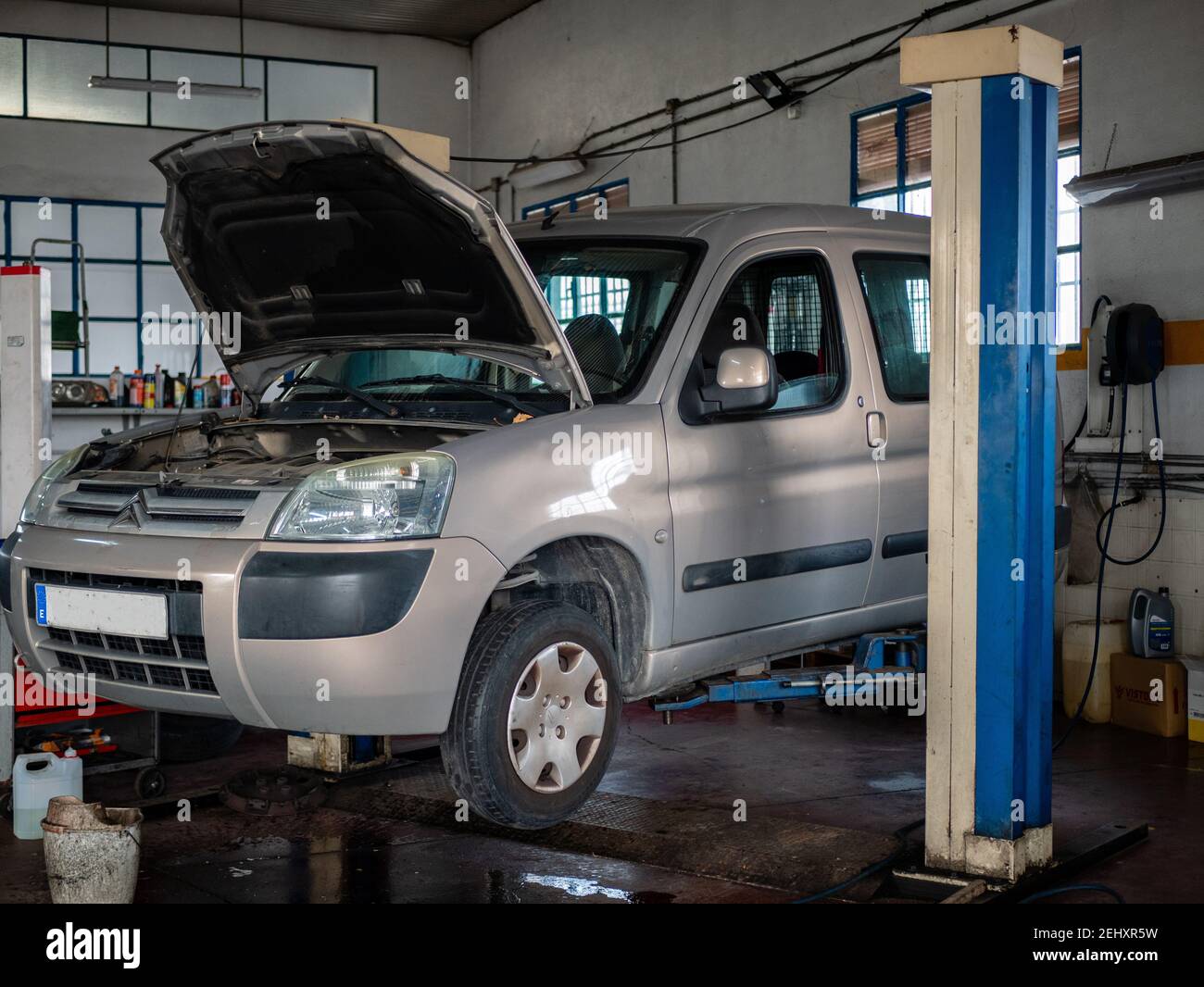 Car raised on a car lift in auto service Stock Photo - Alamy