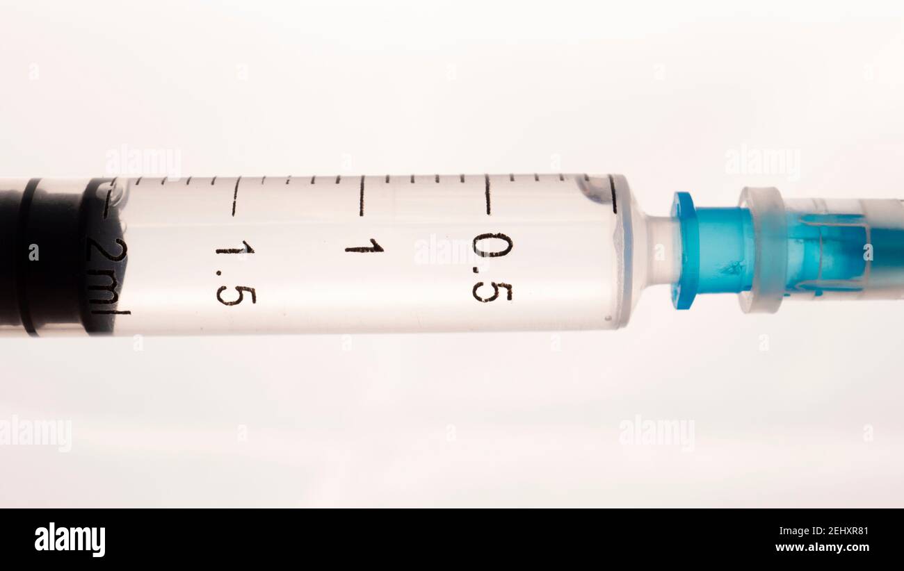 Vaccine vial dose flu shot drug needle syringe Stock Photo - Alamy