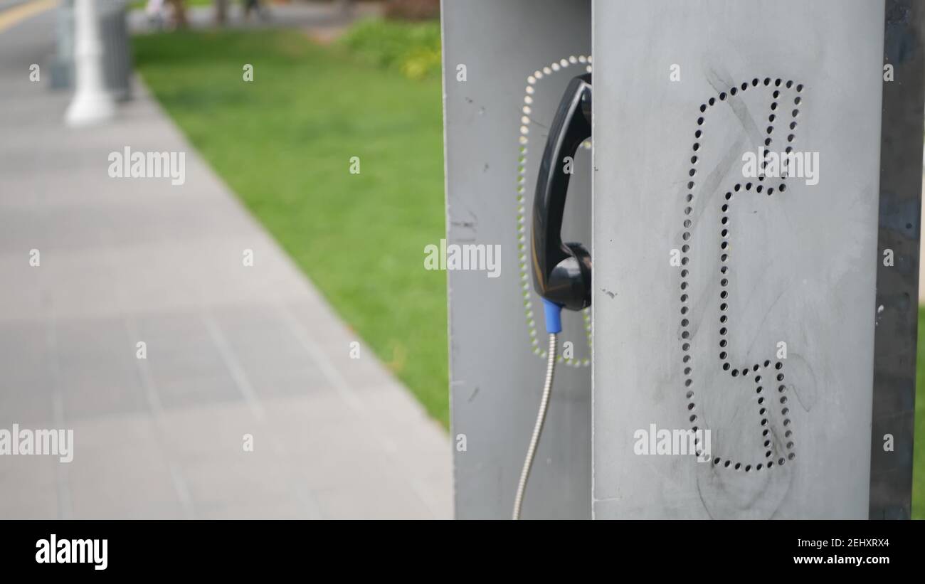 Retro coin-operated payphone station for emergency call on street ...