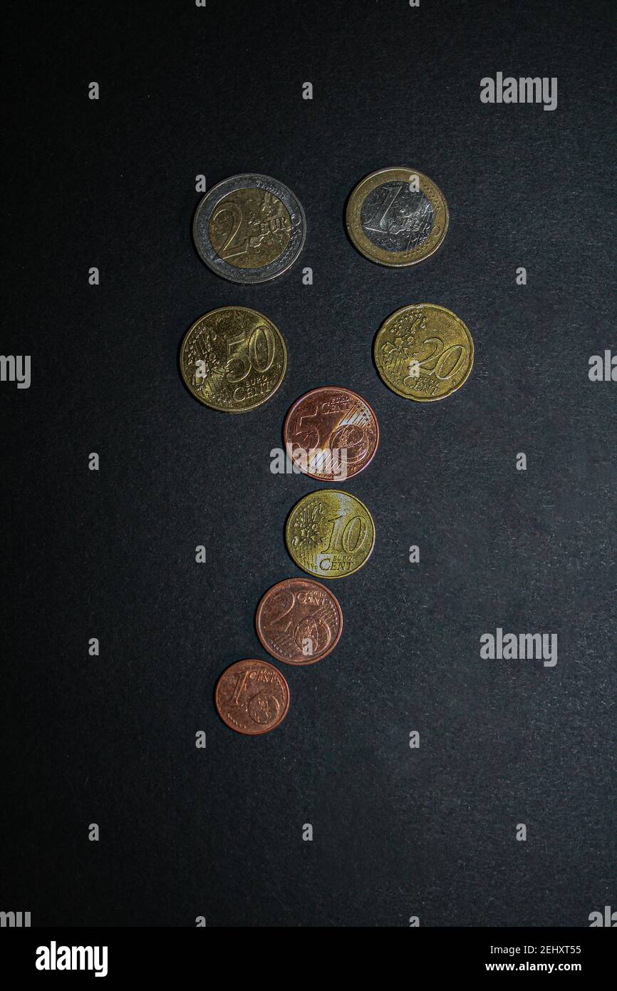 Top view of different euro coins on a black surface Stock Photo - Alamy