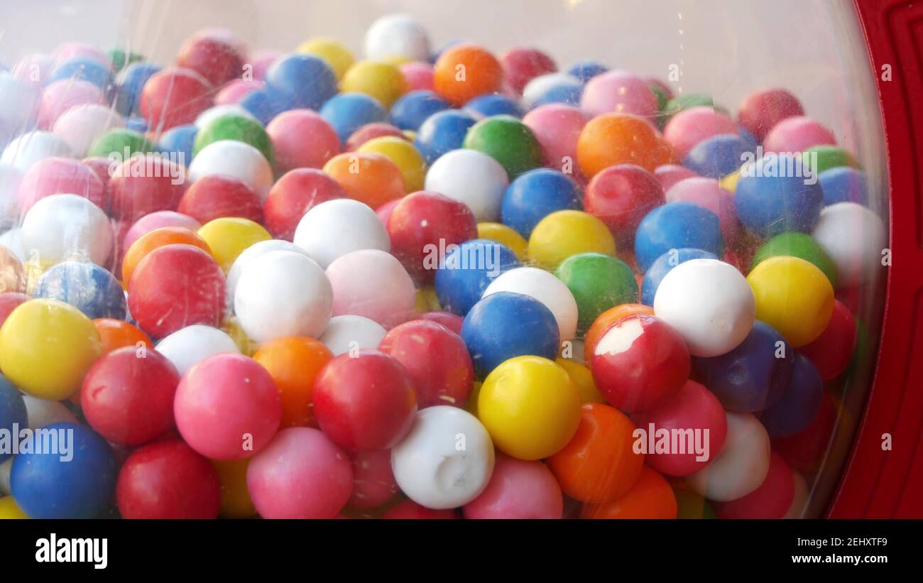Colorful gumballs in classic vending machine, USA. Multi colored buble ...