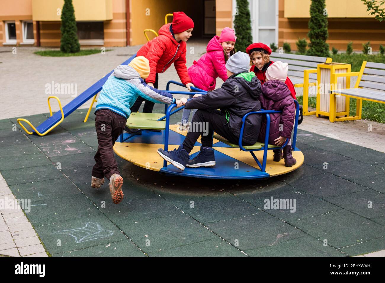 Children play at playground outdoor at the spring Stock Photo - Alamy