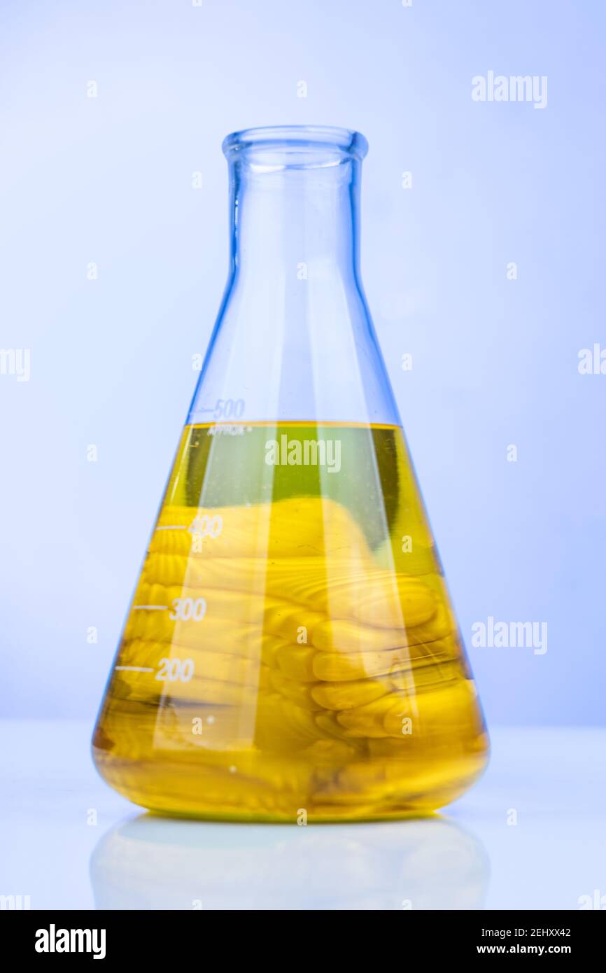 Ethanol biofuel derived from corn maze with beaker in laboratory. Maze ...