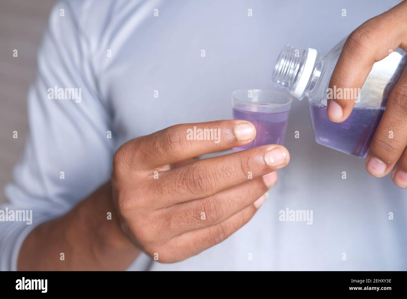 mouthwash liquid flowing into a cap Stock Photo - Alamy