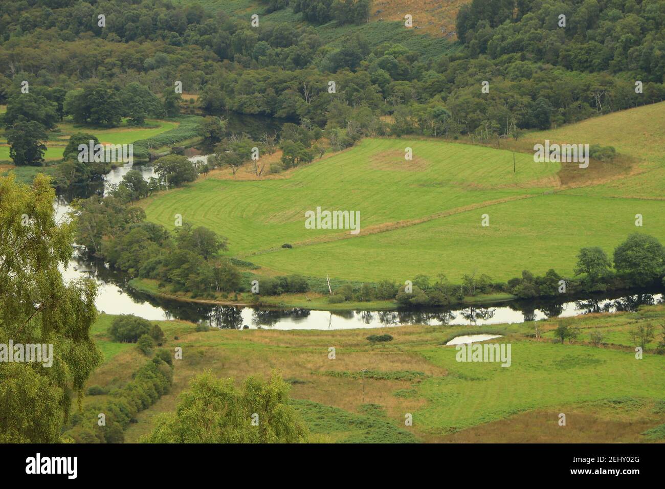A view down from the hills of Scotland to the glens, rivers and lochs ...