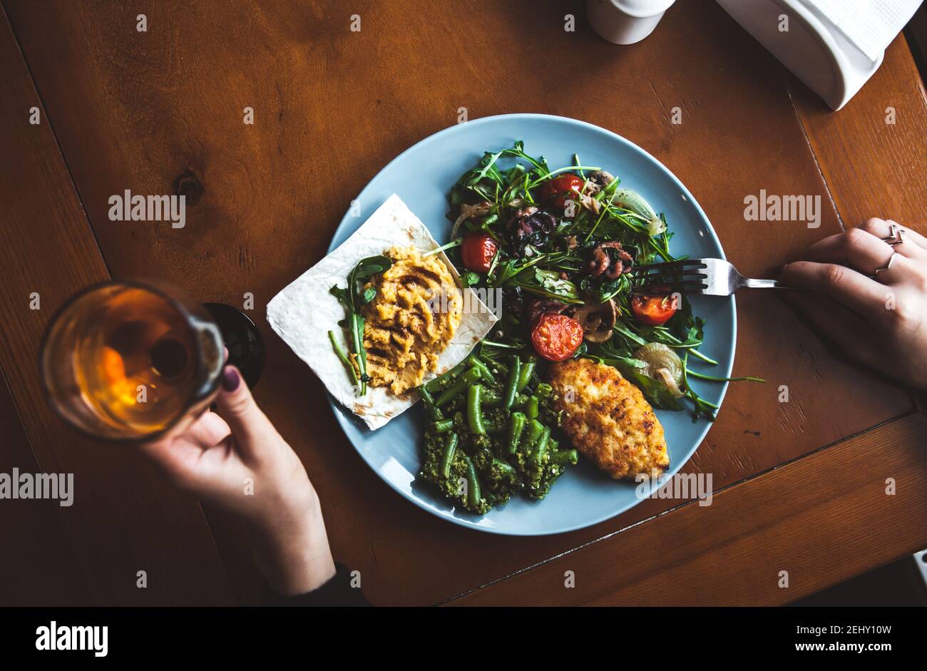 Delicious dinner of two girls in a restaurant. Time for friendship ...