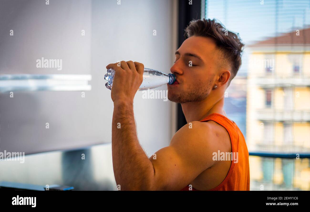 Man drinking water handsome hi-res stock photography and images - Alamy