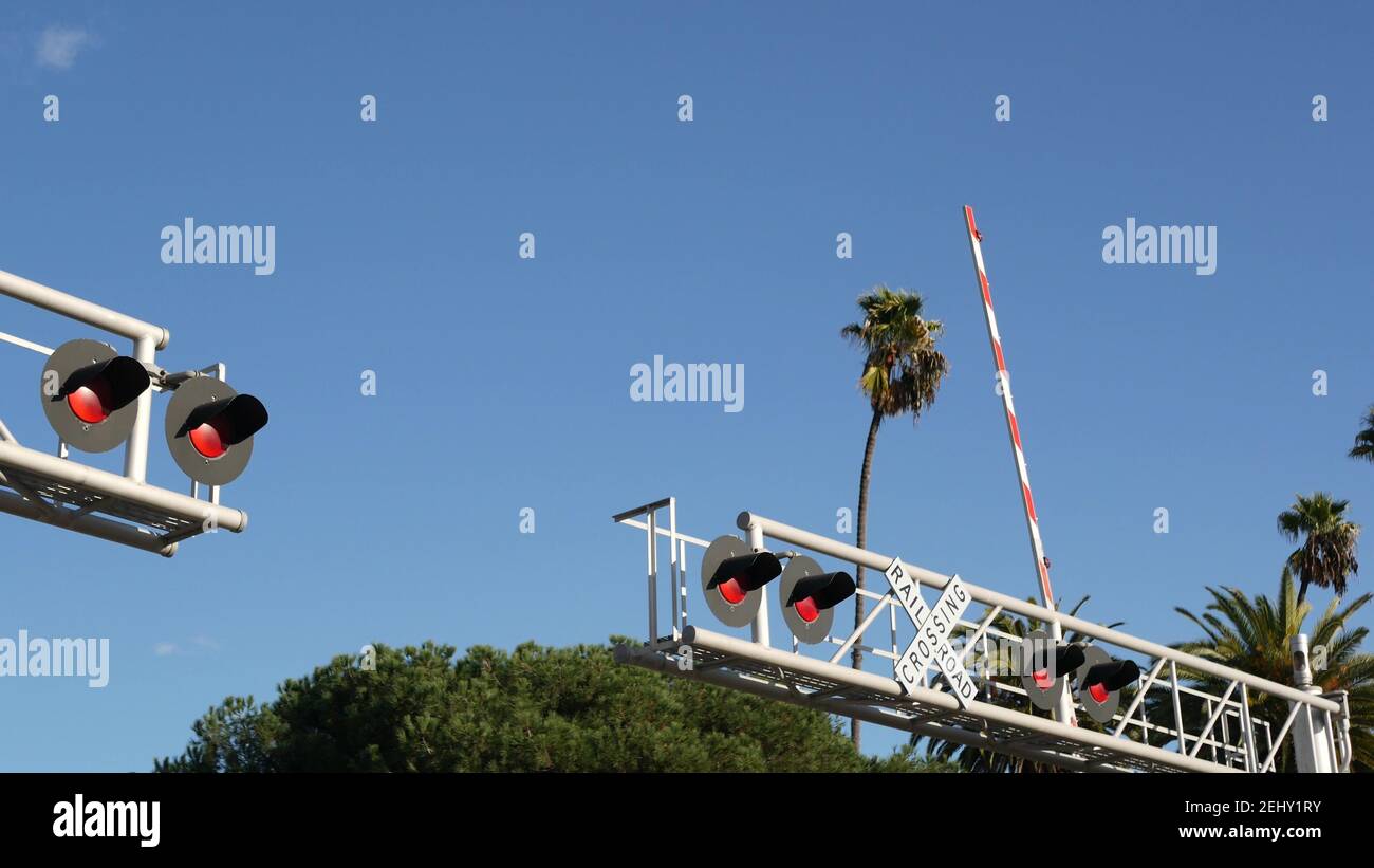Level crossing warning signal in USA. Crossbuck notice and red traffic ...