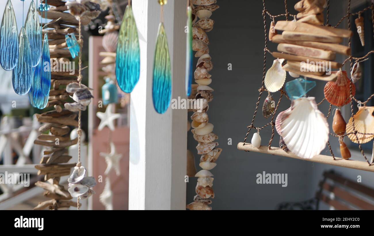 Nautical style hanging seashells decoration, beachfront blue wooden ...