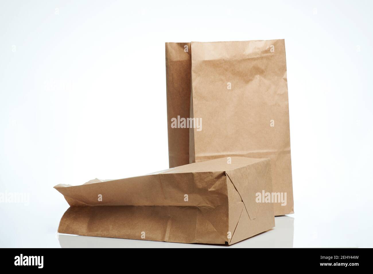 Two brown paper bag for packing isolated on white studio background ...