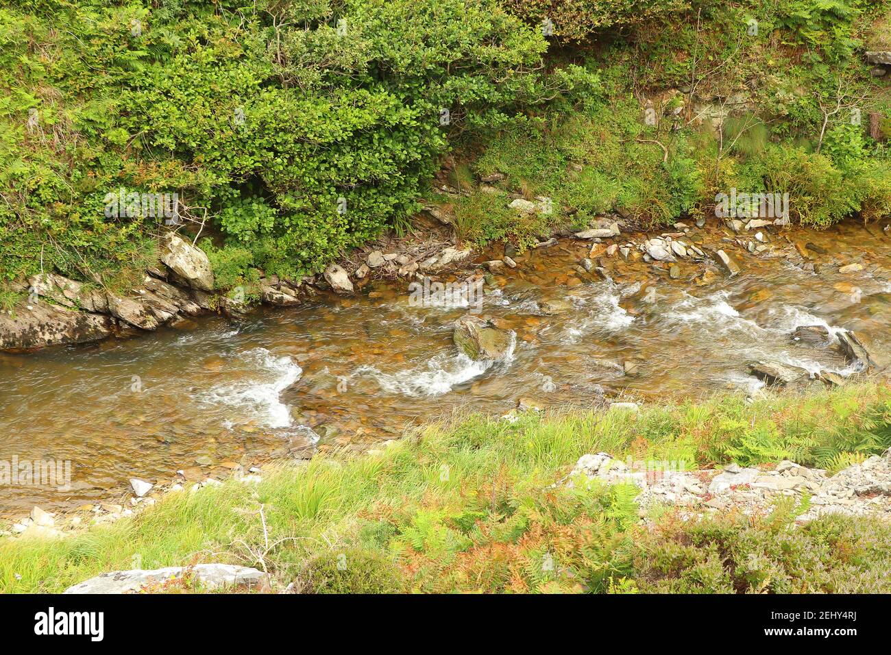 Heddon river flowing through the valley and over rocky ground Stock ...