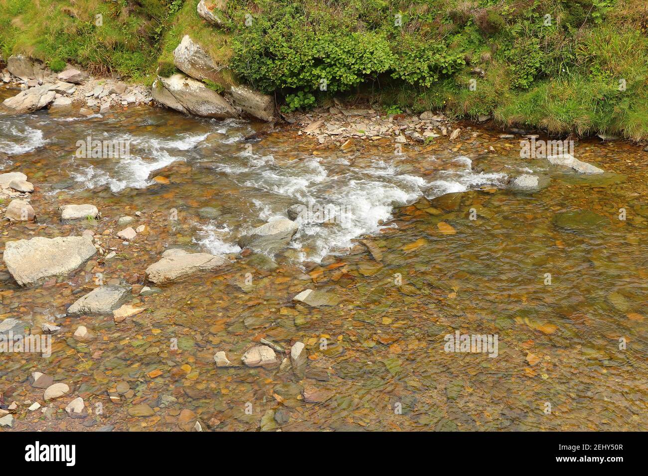 Heddon river flowing through the valley and over rocky ground Stock ...