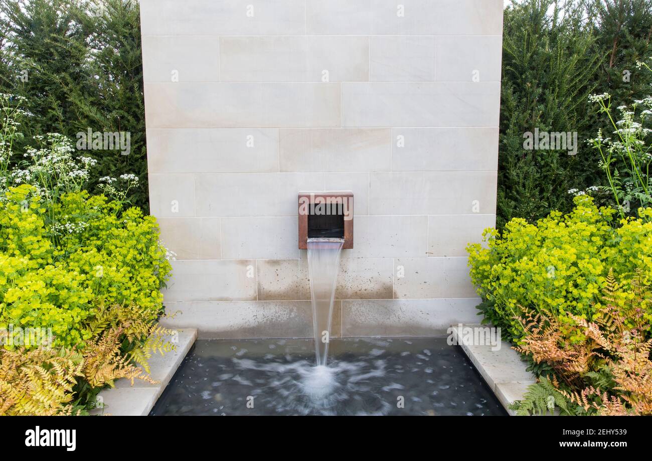garden with Yorkstone stone wall panel a corten steel water feature ...