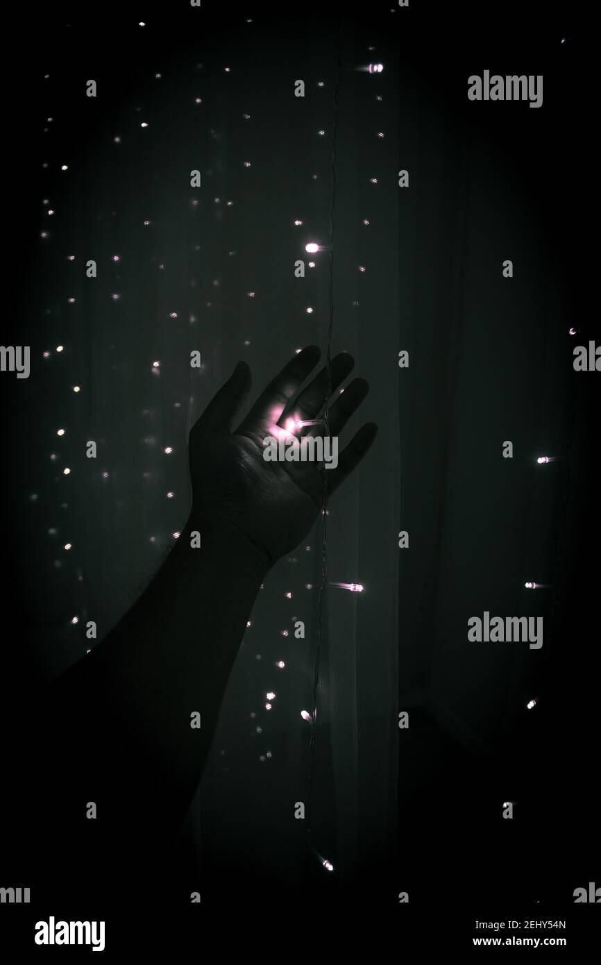 Holding a little light in the dark Stock Photo - Alamy