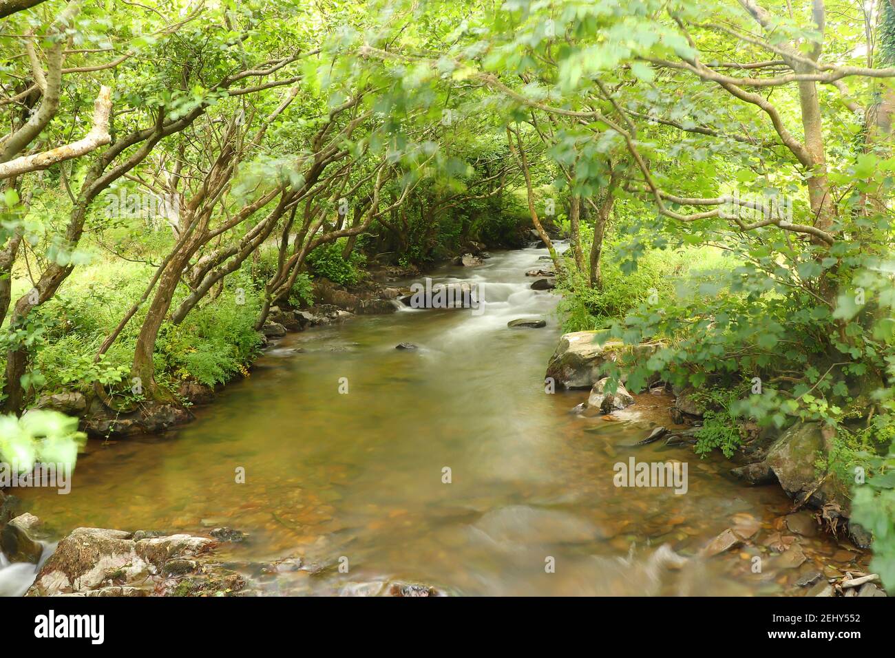 Heddon river flowing through the valley and over rocky ground Stock ...