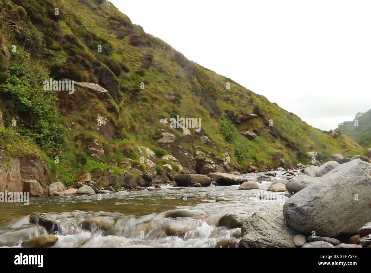 Heddon river flowing through the valley and over rocky ground Stock ...
